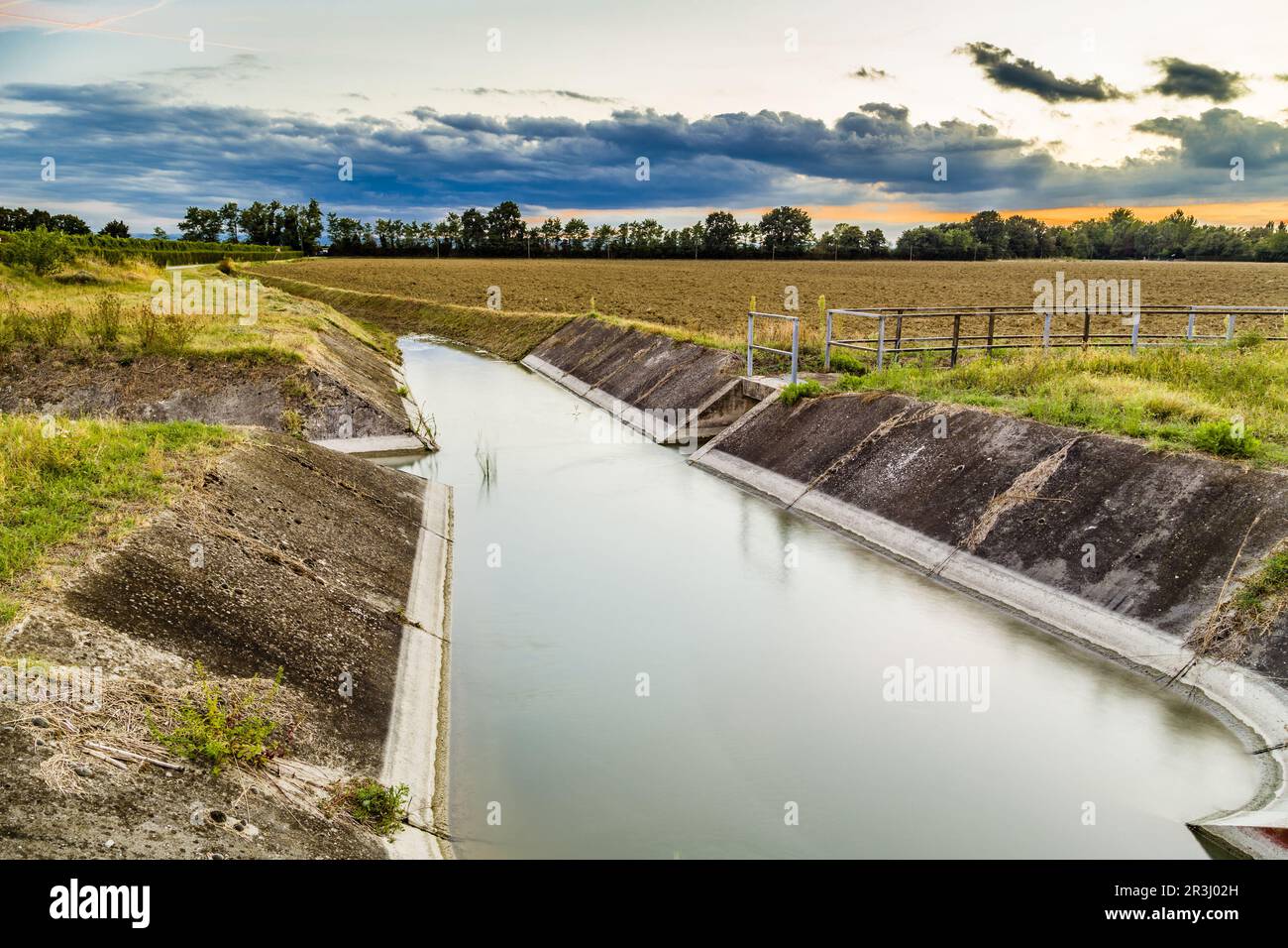 Channel for irrigation of cultivated fields Stock Photo - Alamy