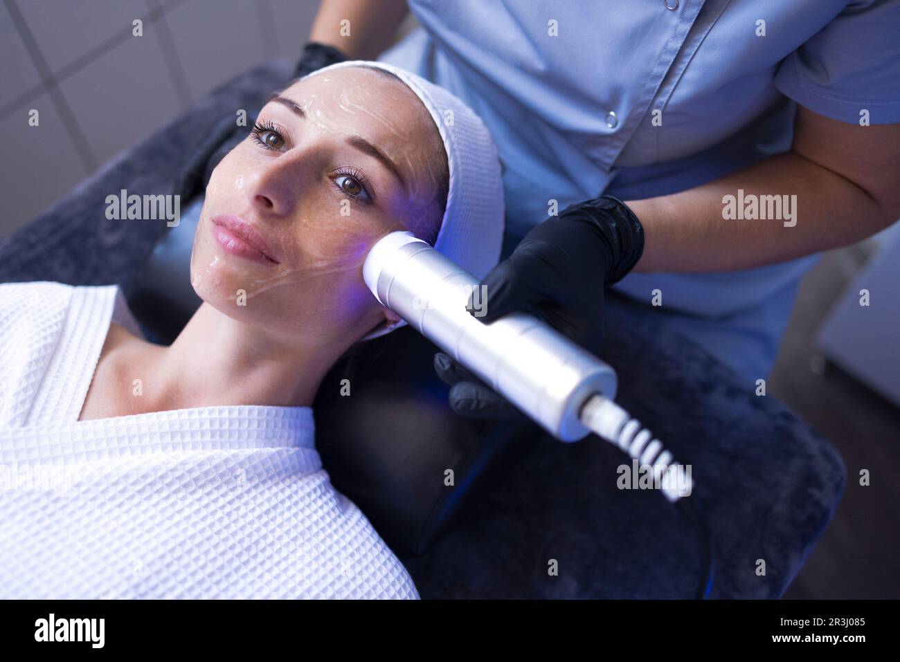 Closeup of face of beautiful relaxing girl undergoing hardware ...