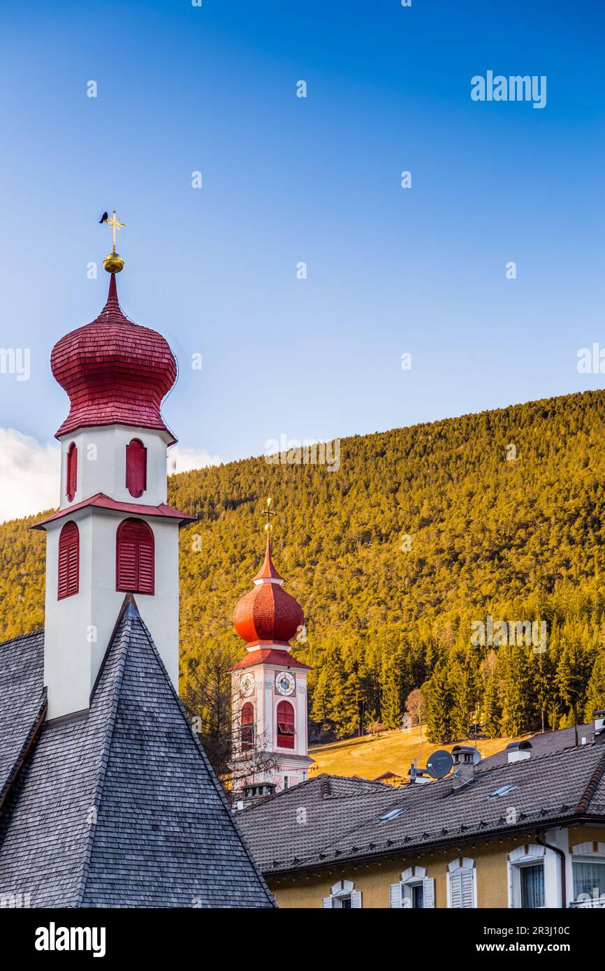 Red bell towers of a mountain village Stock Photo - Alamy