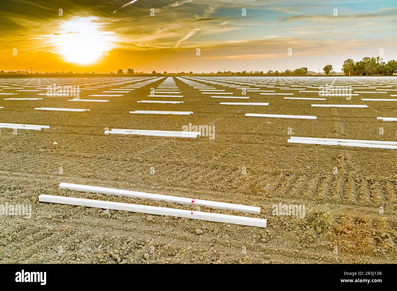 Geometric designs of support poles in farmlands Stock Photo - Alamy