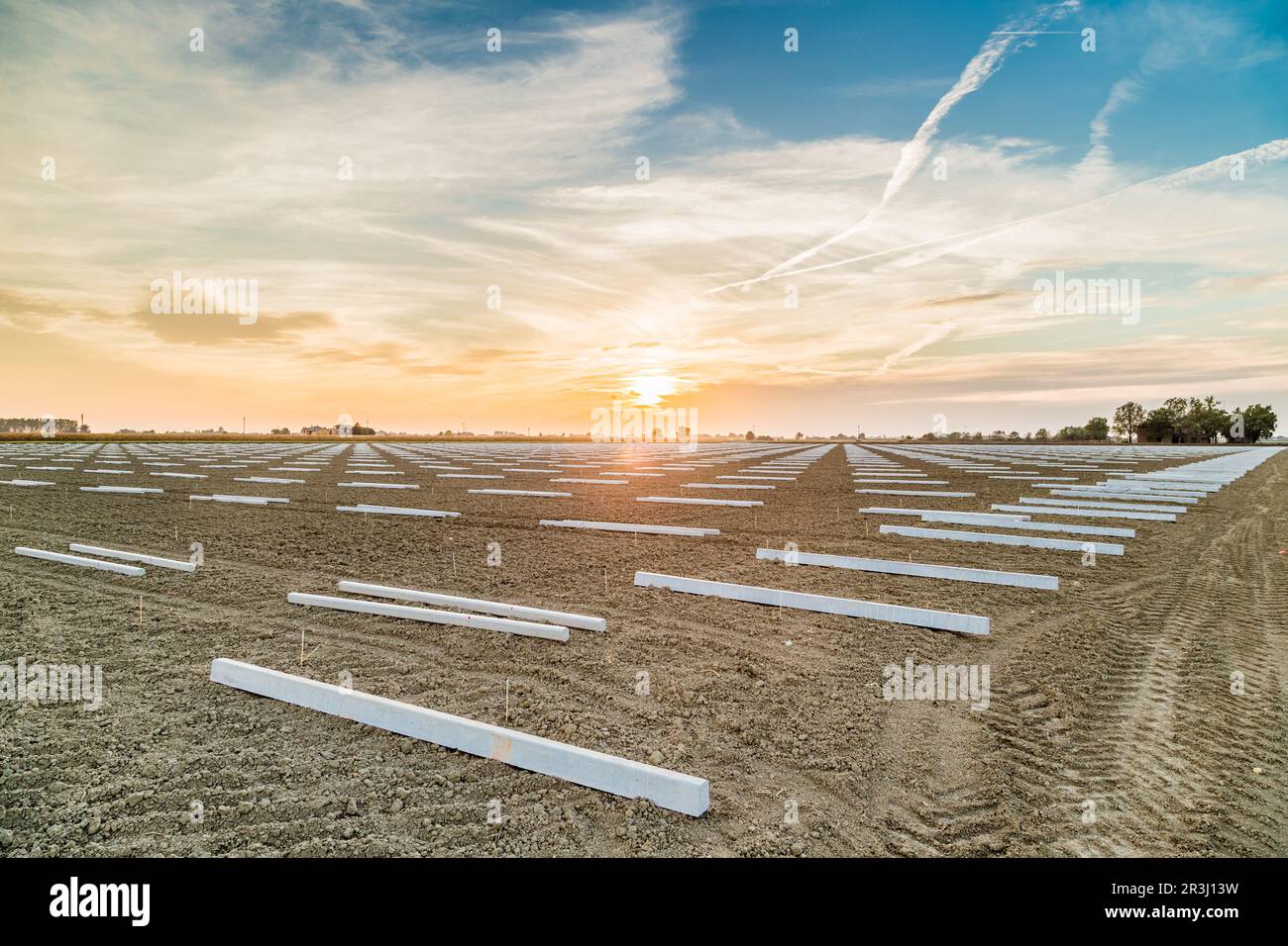 Geometric designs of support poles in farmlands Stock Photo - Alamy