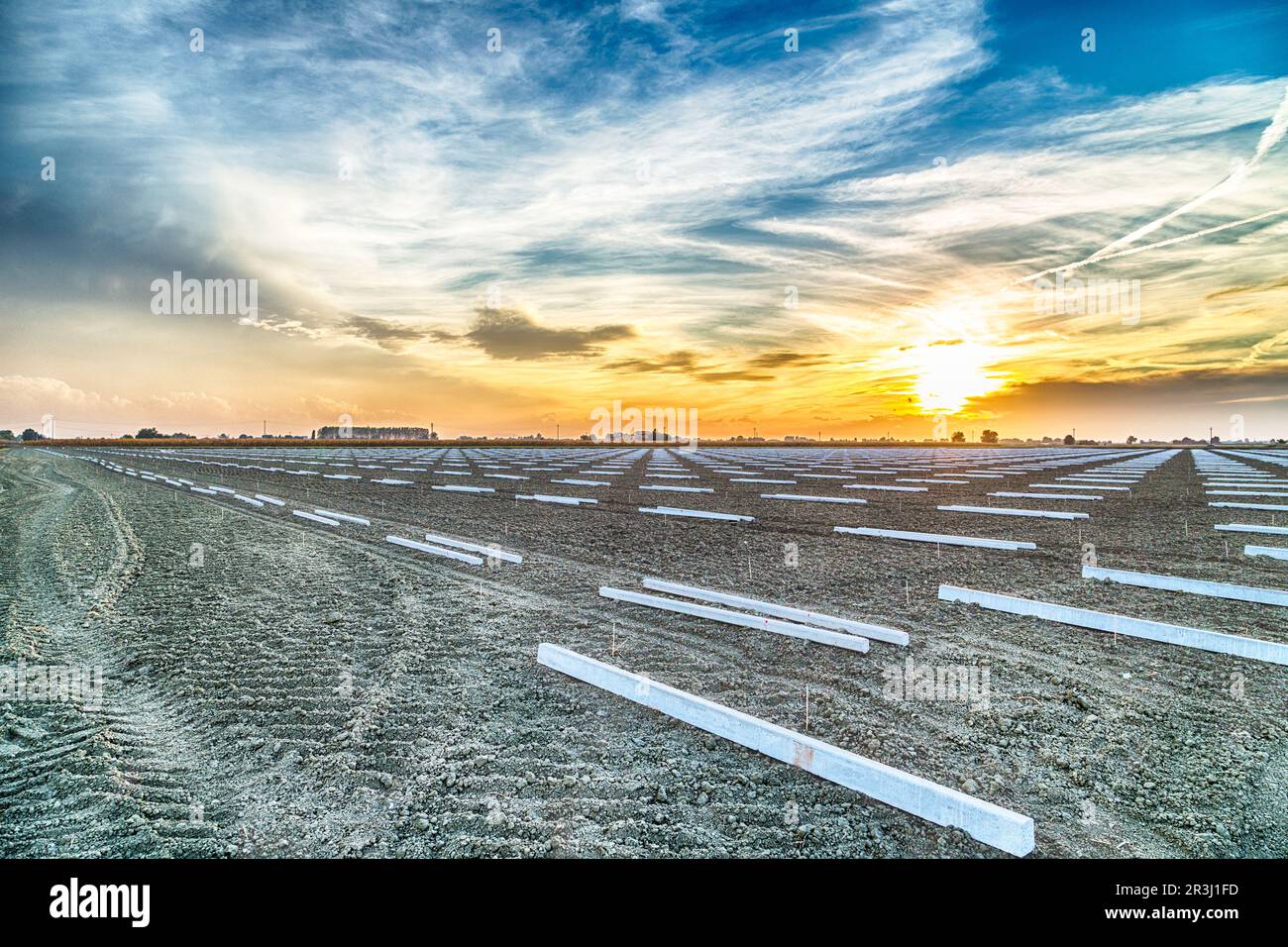 Geometric designs of support poles in farmlands Stock Photo - Alamy