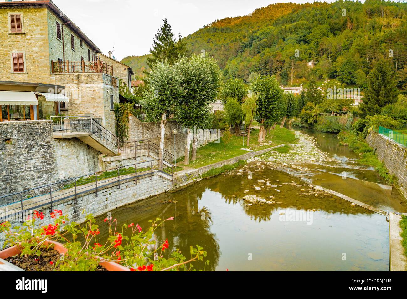 River through mountain village in Tuscany Stock Photo - Alamy