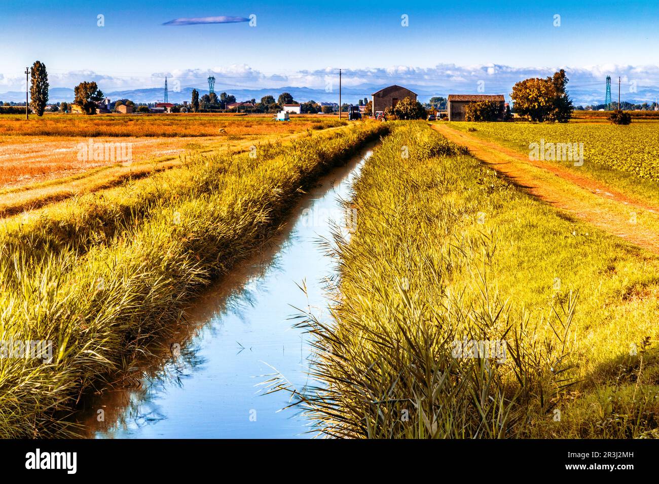 Irrigation canal in Italian countryside Stock Photo - Alamy