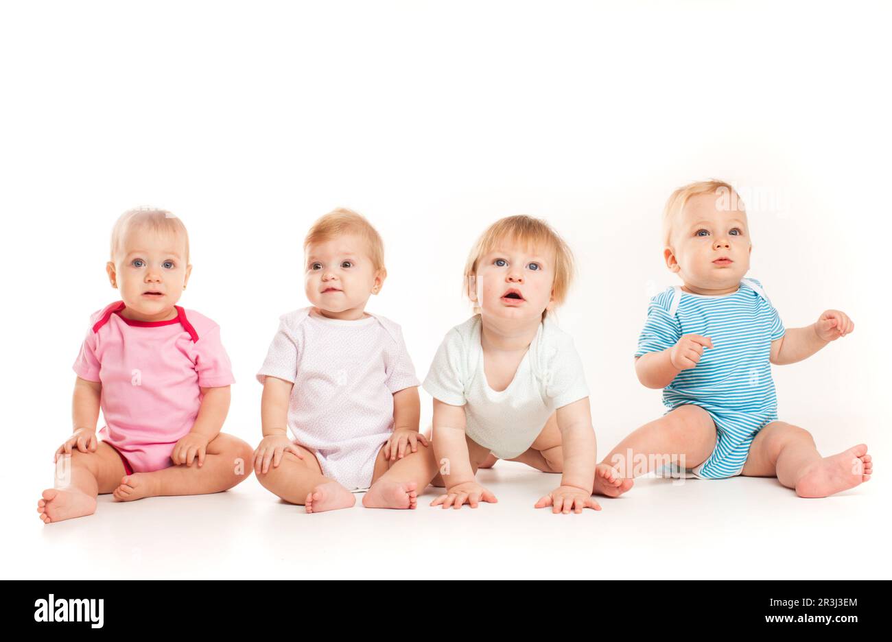 Four babies isolated isolated on white background Stock Photo - Alamy