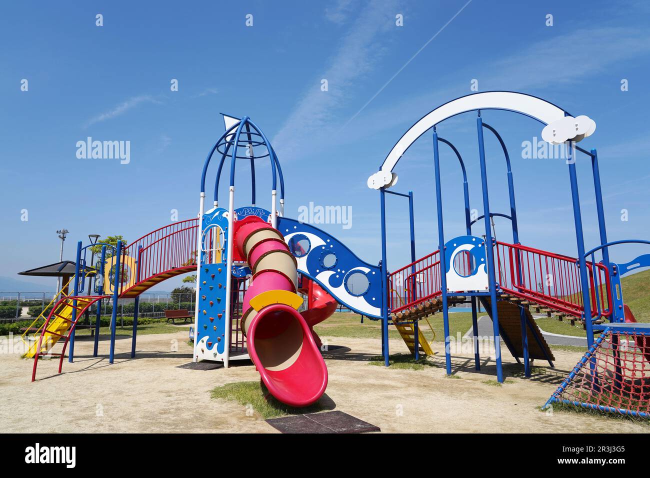 Children playground in park and nice blue sky Stock Photo - Alamy