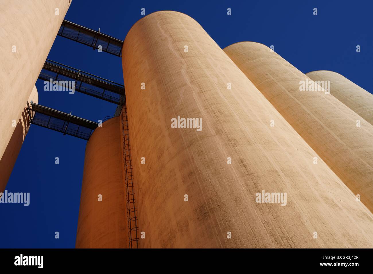 Concrete Grain Silos Connected by Steel Bridges, From Ground Against ...