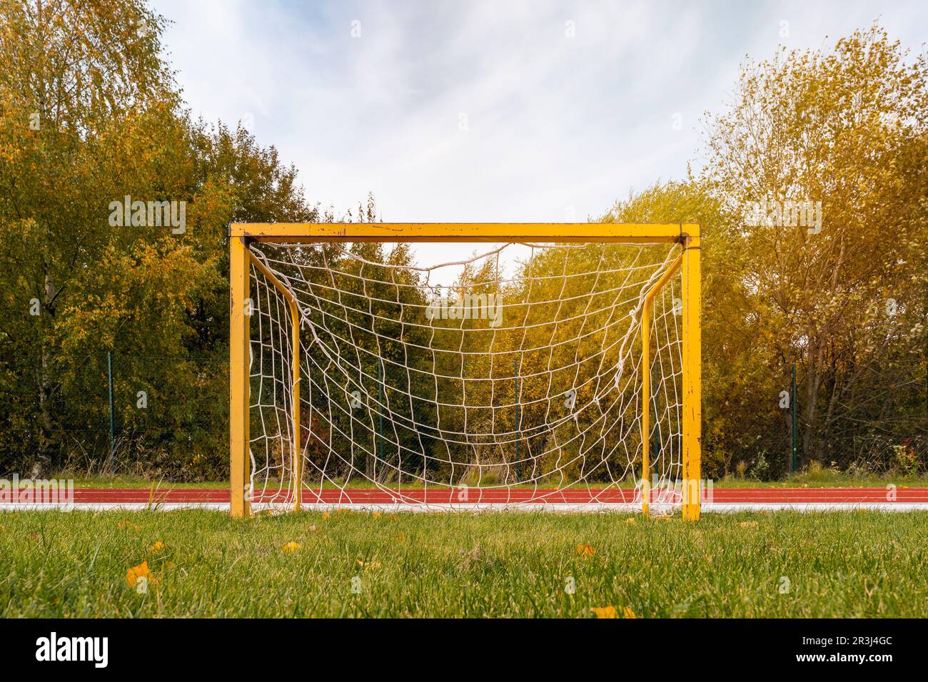 Front view of a small yellow football goals Stock Photo - Alamy