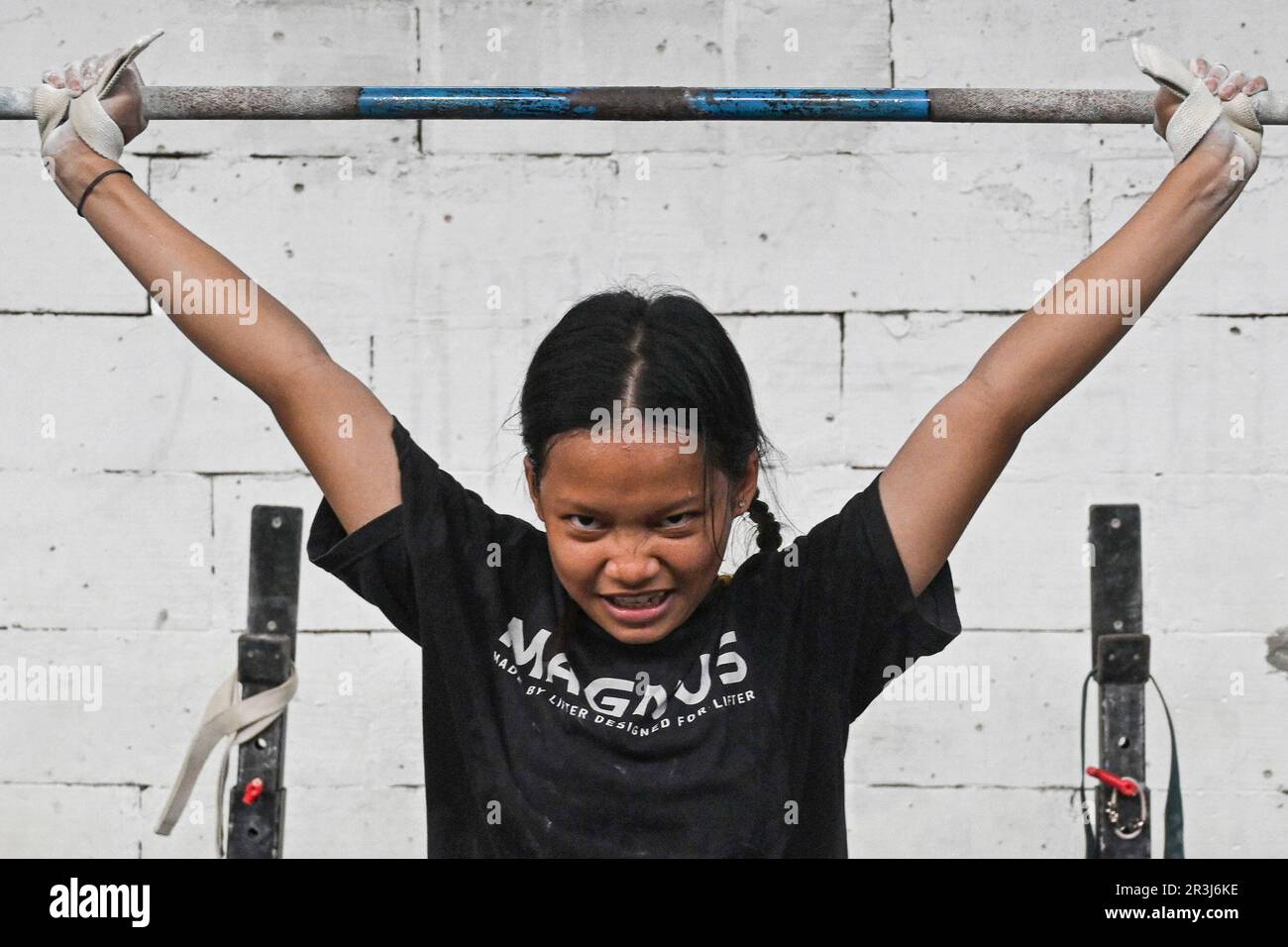Bogor, Indonesia. 23rd May, 2023. A girl practices weightlifting at ...