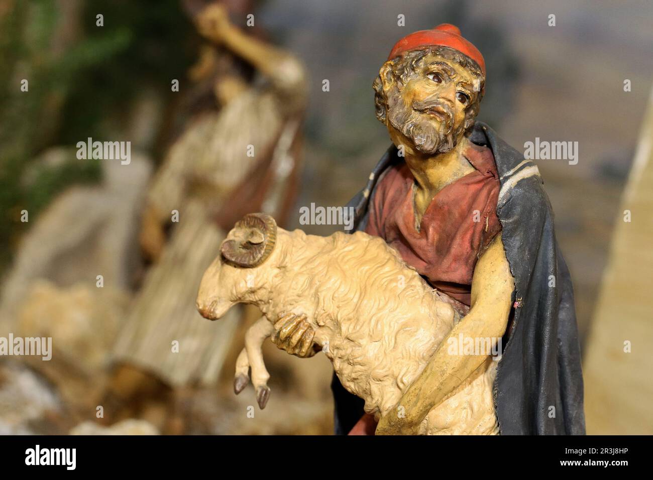 Nativity figurine, Shepherd with sheep Stock Photo - Alamy