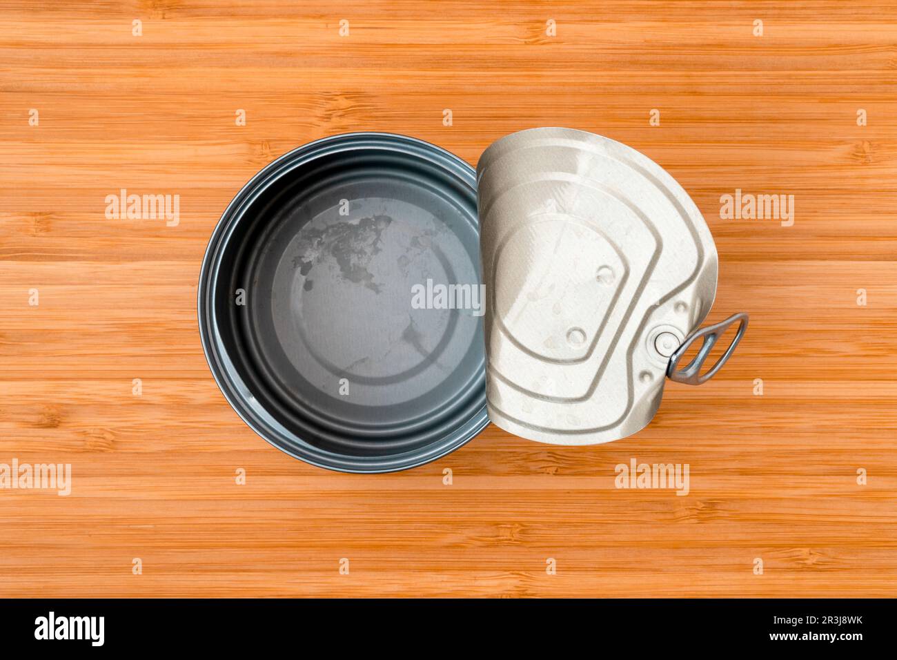 Old tin can for food on wooden background Stock Photo - Alamy
