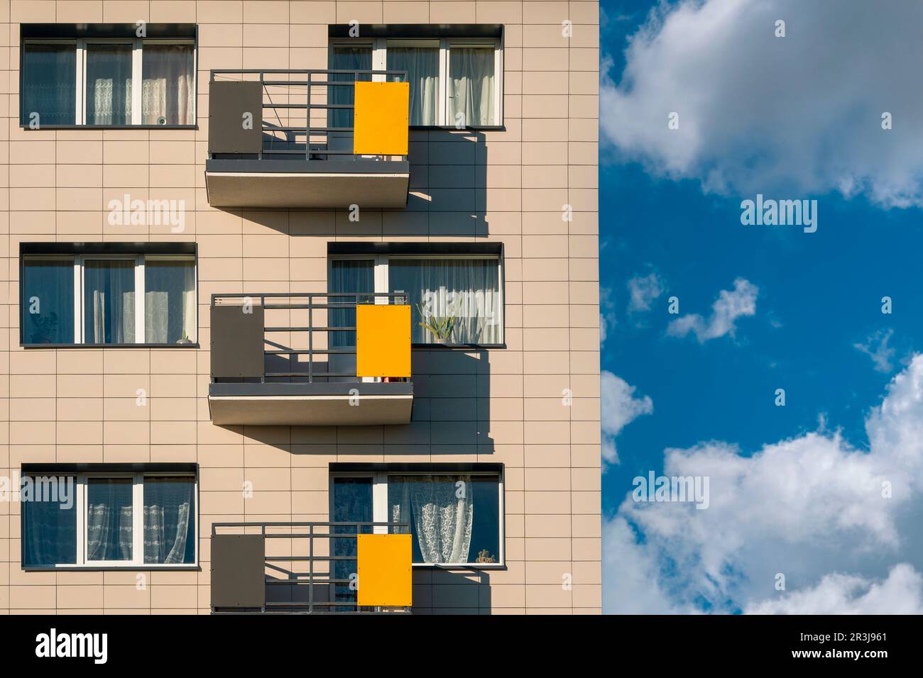 Modern Facade Building with Yellow Balconies Stock Photo - Alamy