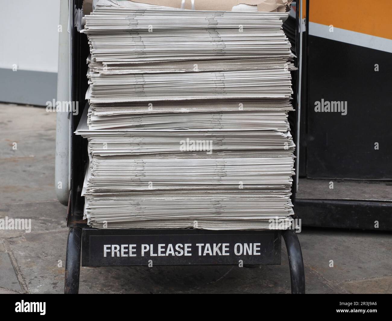 Free please take one newspaper Stock Photo - Alamy