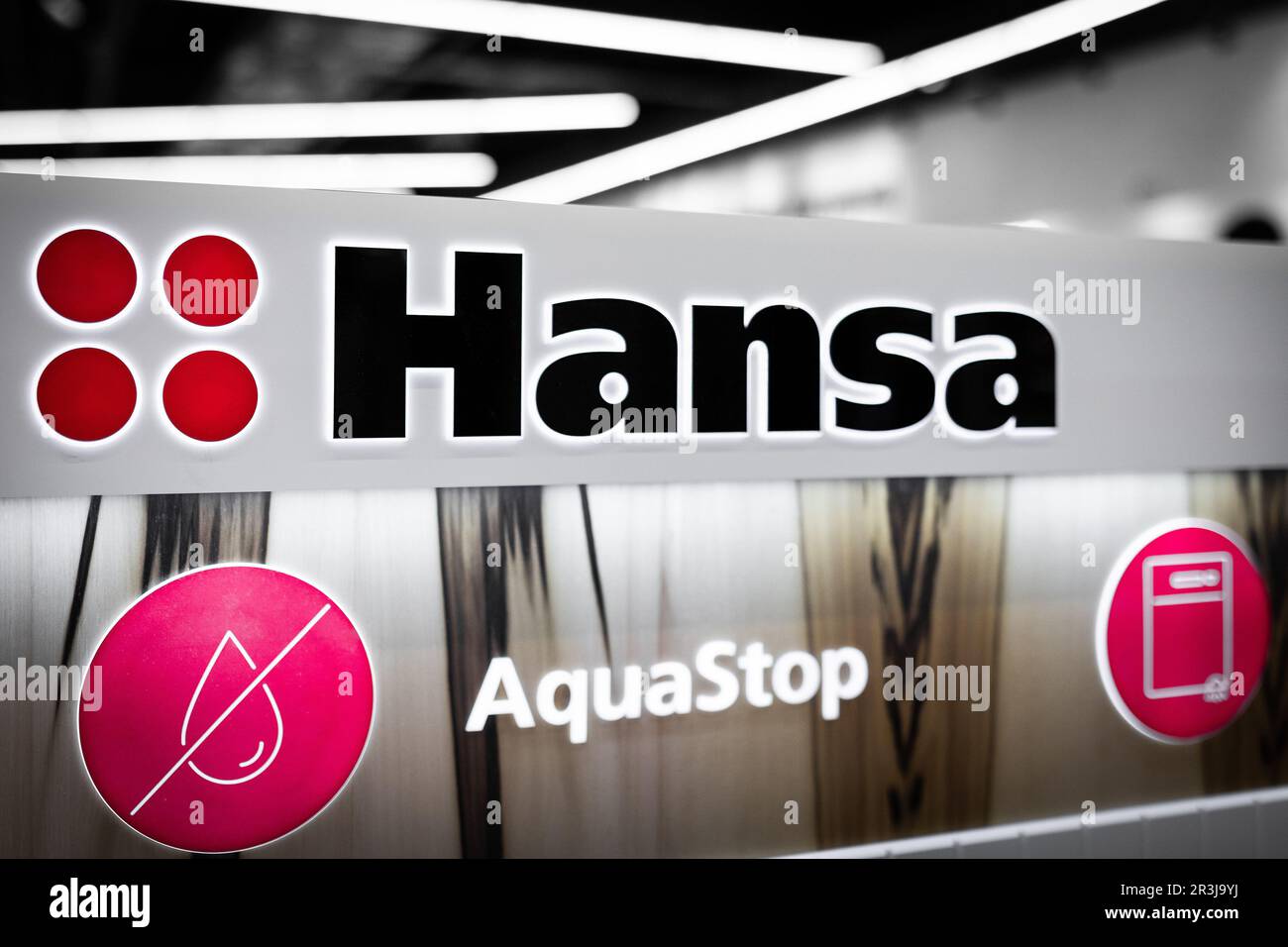 Close-up on the HANSA logo on a decorative wall near washing machines ...