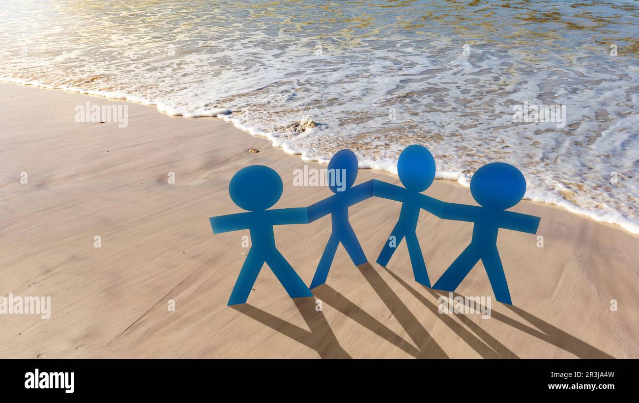 Paper people are holding hands symbol of friendship. International ...