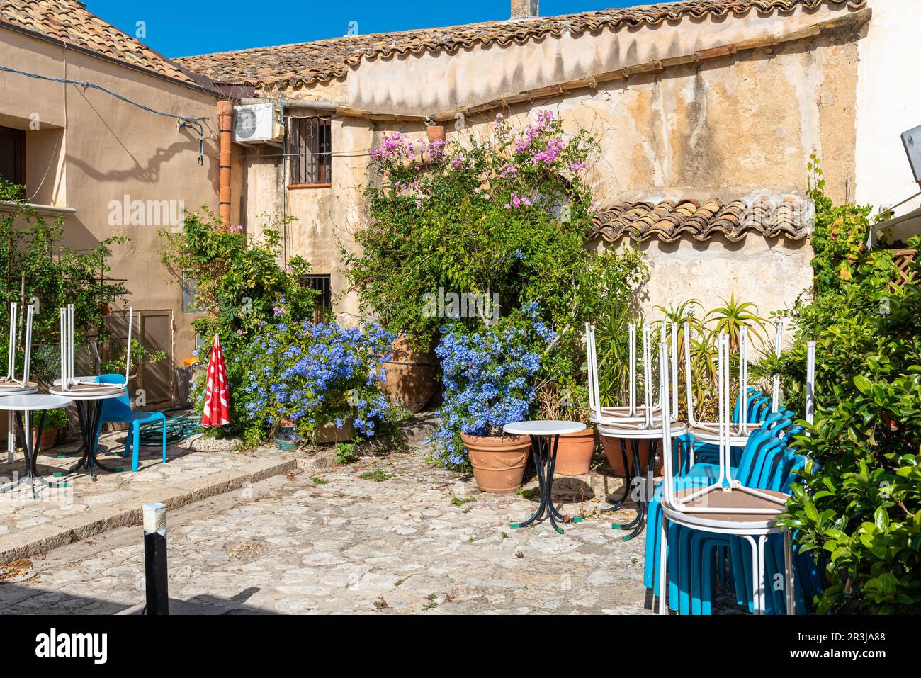 Courtyard restaurant in village hi-res stock photography and images - Alamy