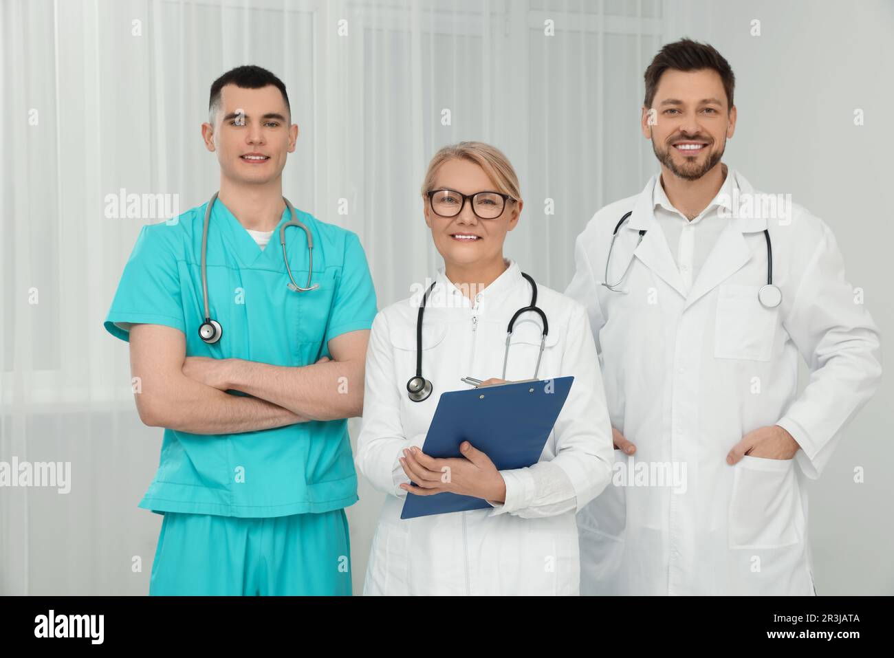 Portrait of medical doctors wearing uniforms indoors Stock Photo - Alamy