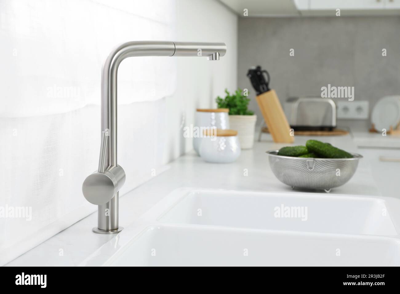 Modern sink and water tap on kitchen counter. Interior design Stock ...