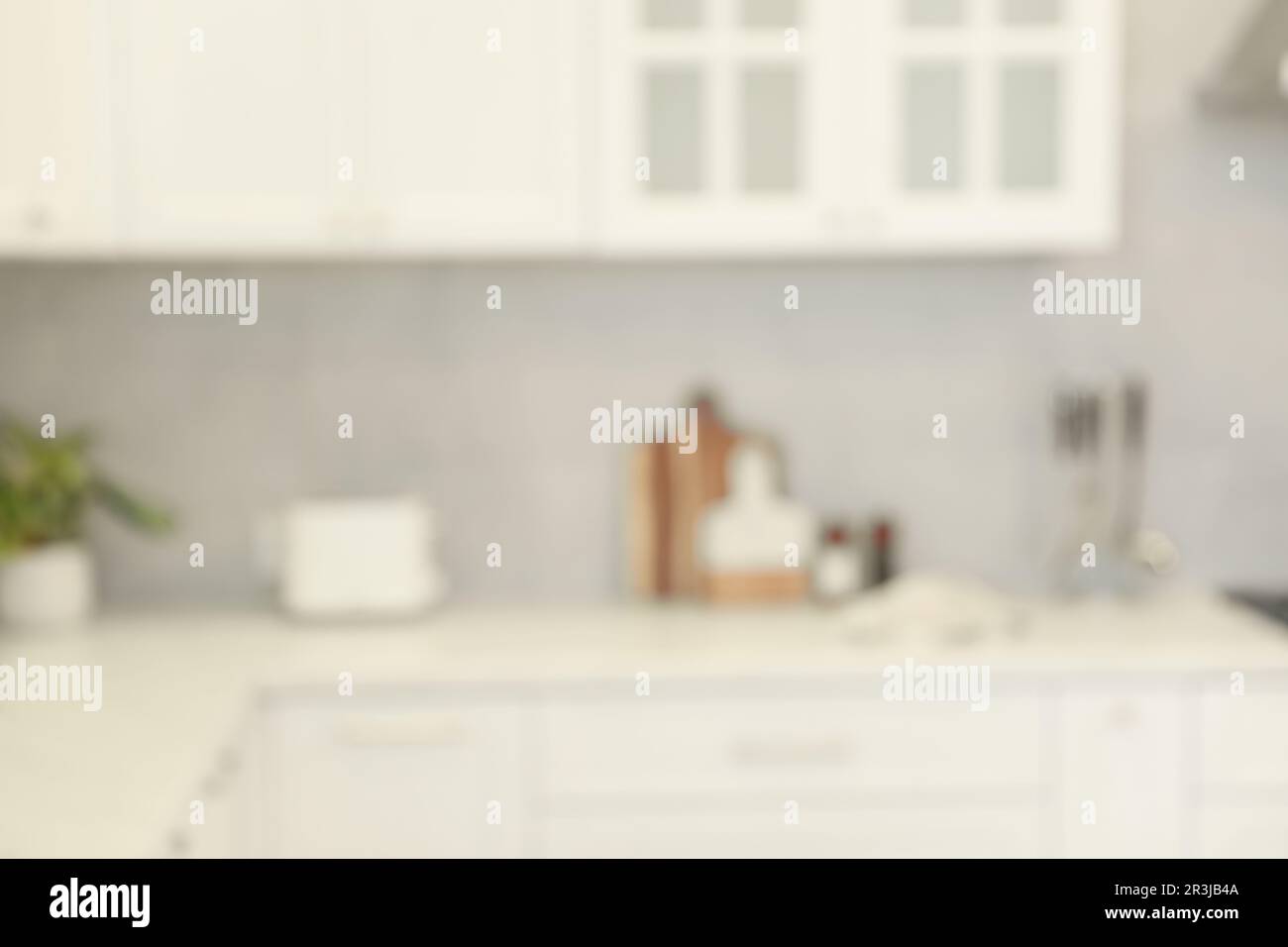 Blurred view of modern kitchen. Interior design Stock Photo - Alamy