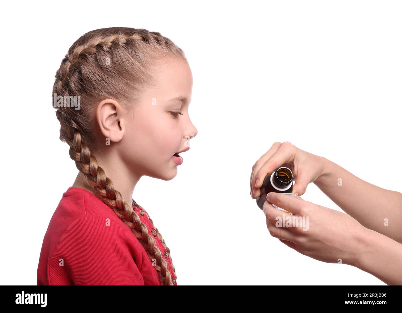 Mother pouring syrup into measuring cup for her daughter on white ...