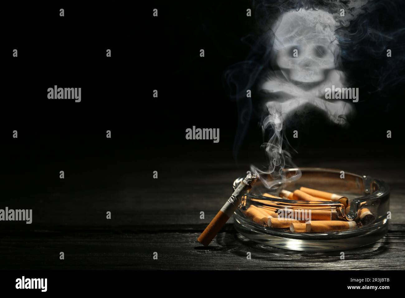 No Smoking. Skull and crossbones symbol of smoke over ashtray with ...