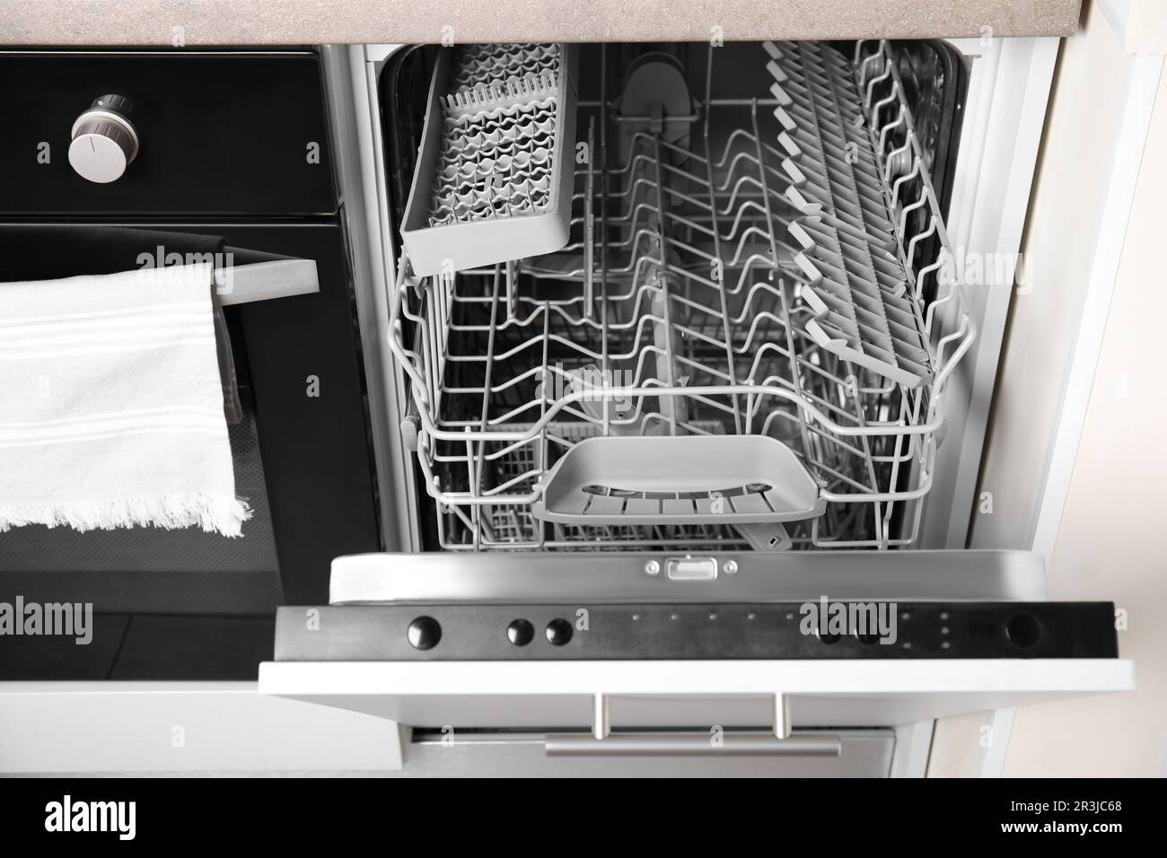 Open clean empty dishwasher in kitchen. Home appliance Stock Photo - Alamy