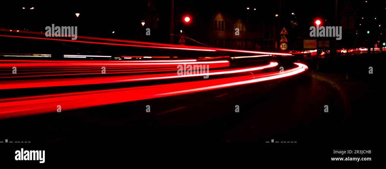 Lights of cars at night. Street line lights. Night highway city. Long ...