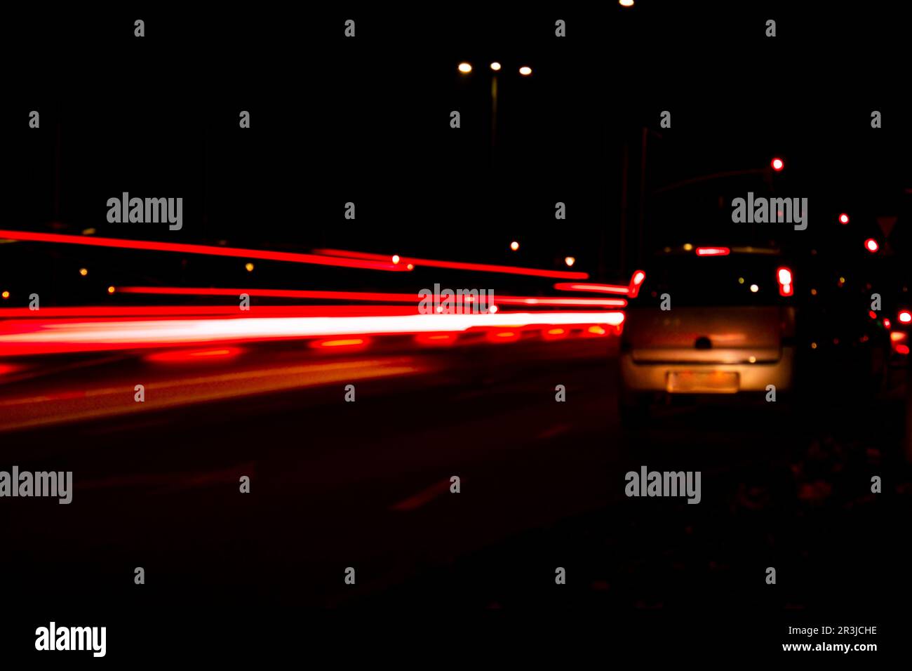 Lights of cars at night. Street line lights. Night highway city. Long ...