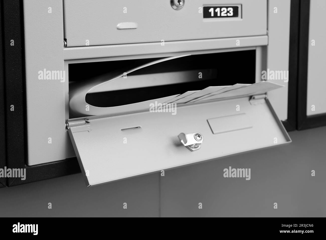 Open grey metal mailbox with envelopes indoors Stock Photo - Alamy