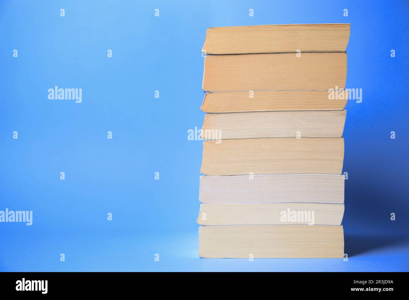 Collection of books on light blue background, space for text Stock ...