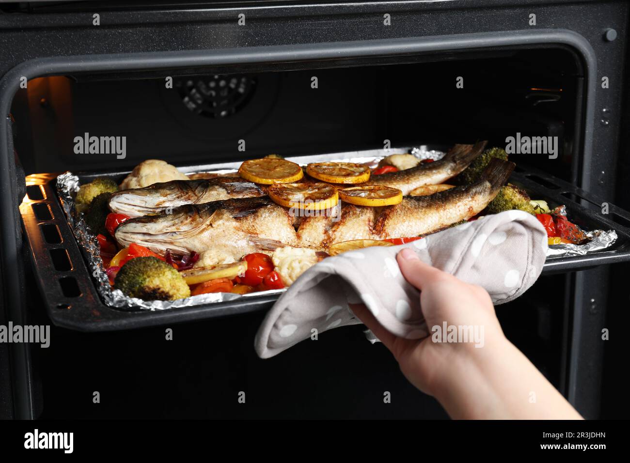 Woman taking cut lemon from hi-res stock photography and images - Alamy