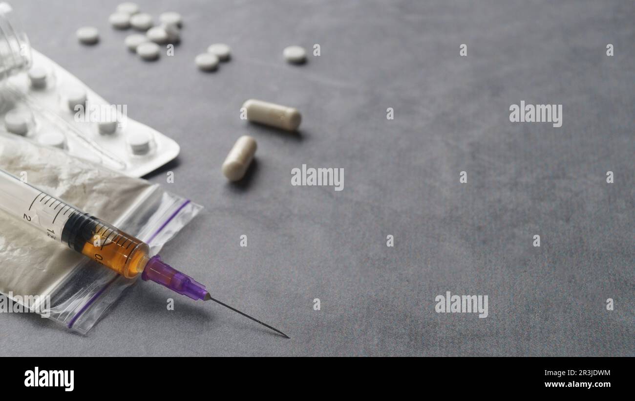 Different hard drugs on grey table, closeup. Space for text Stock Photo ...