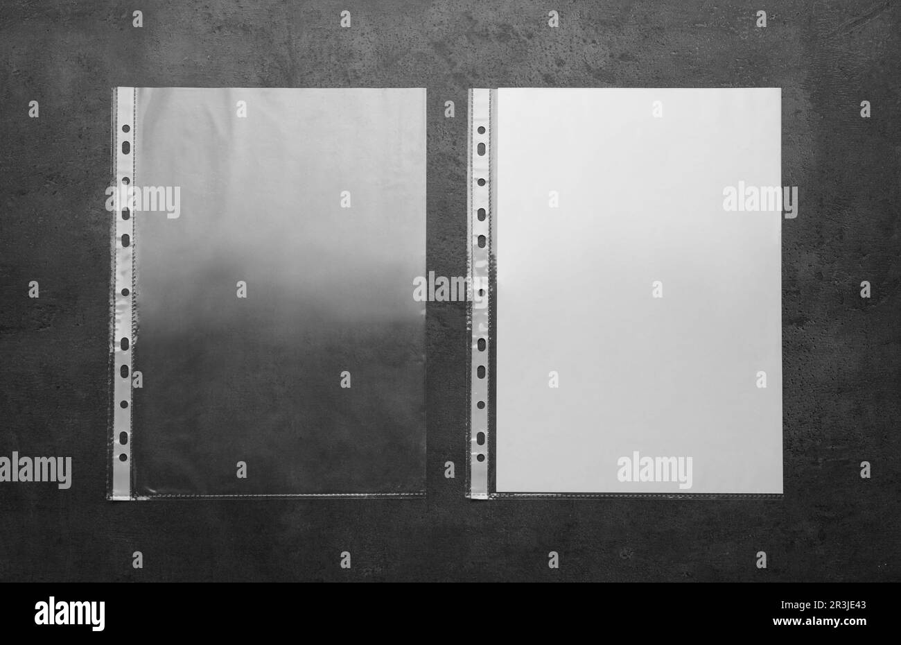 Punched pockets on light grey table, flat lay Stock Photo - Alamy