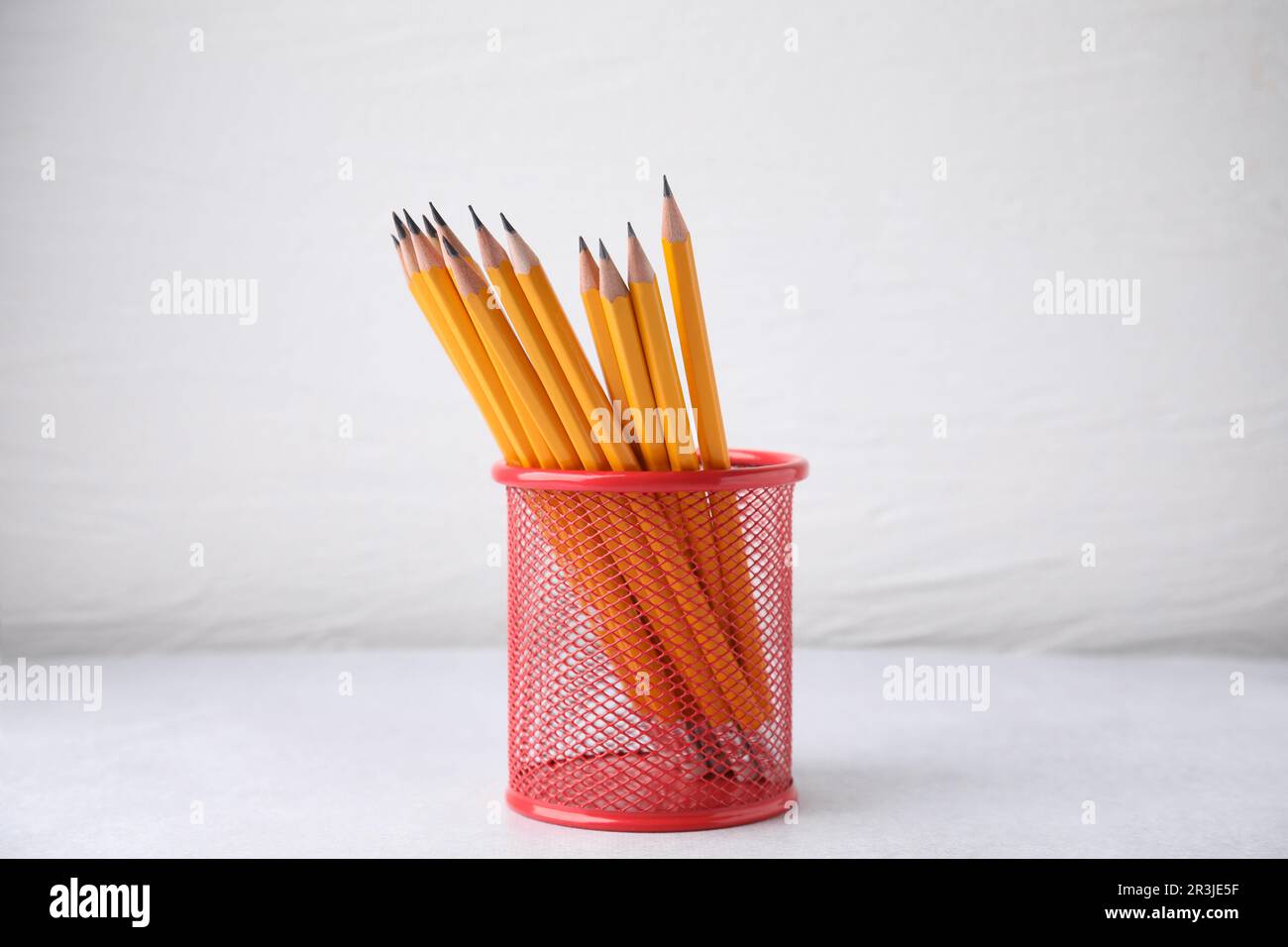 Many sharp pencils in holder on white background Stock Photo - Alamy