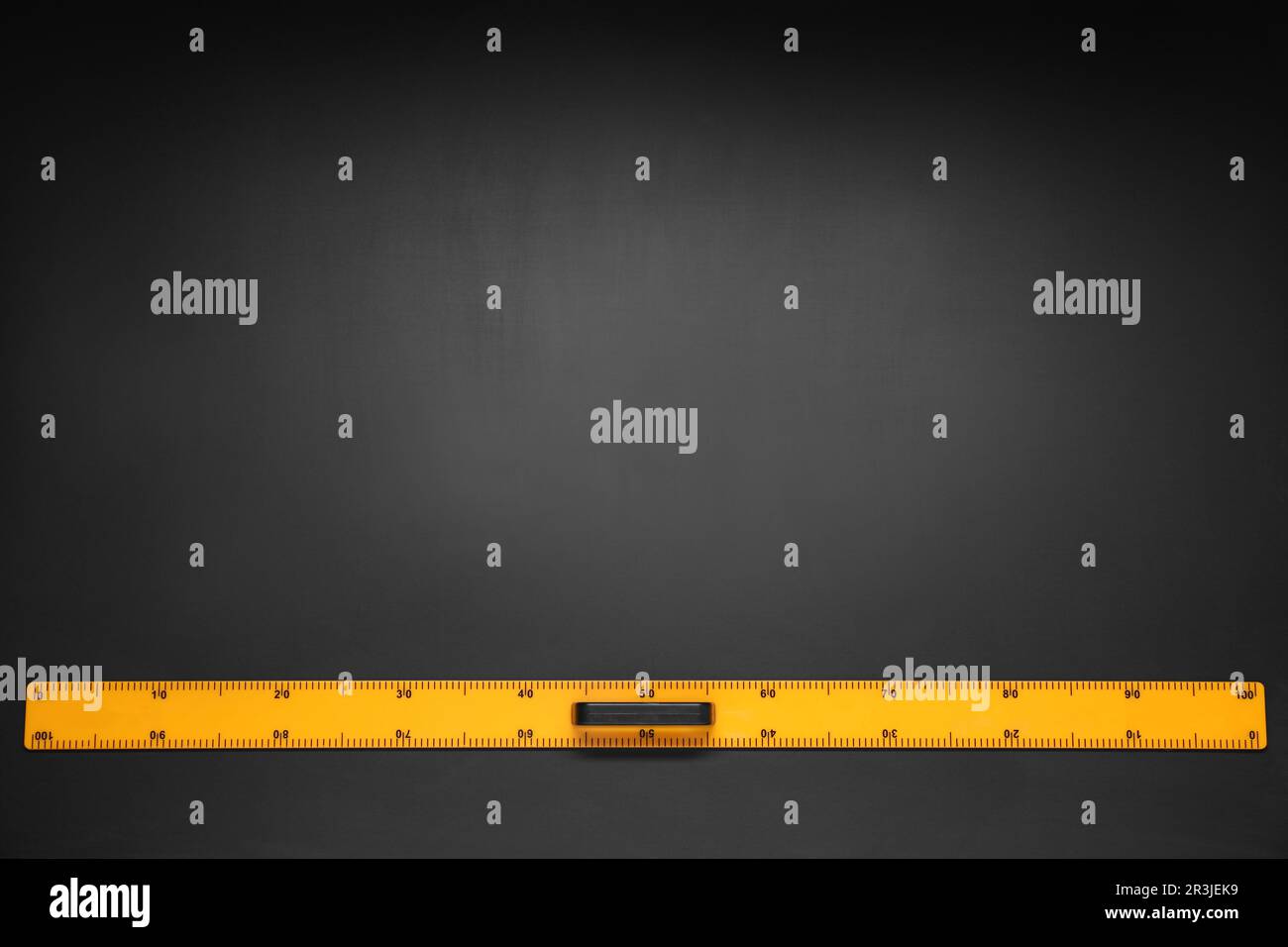 Yellow school ruler on blackboard, top view. Space for text Stock Photo ...