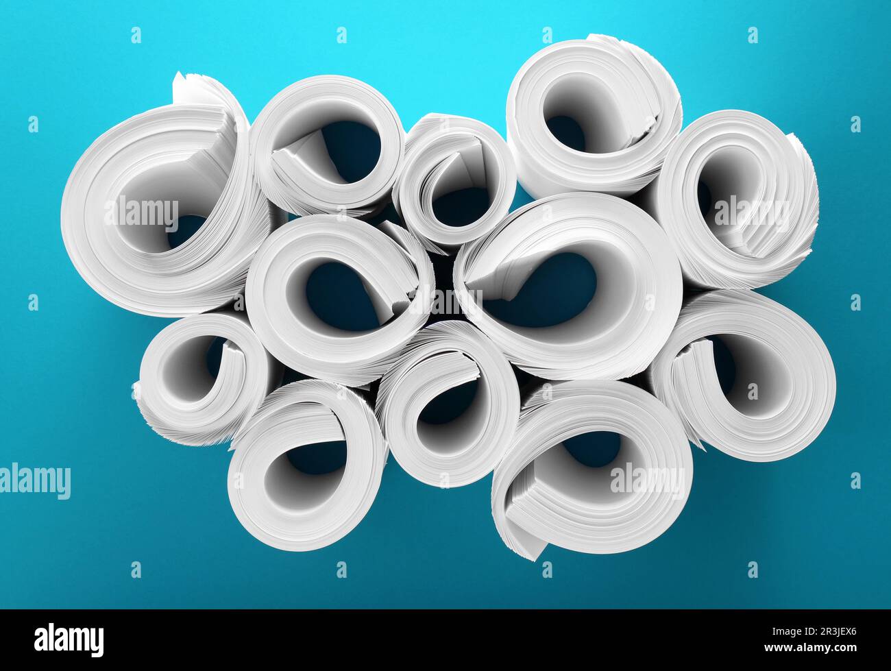 Blank white paper rolls on light blue background, flat lay Stock Photo ...