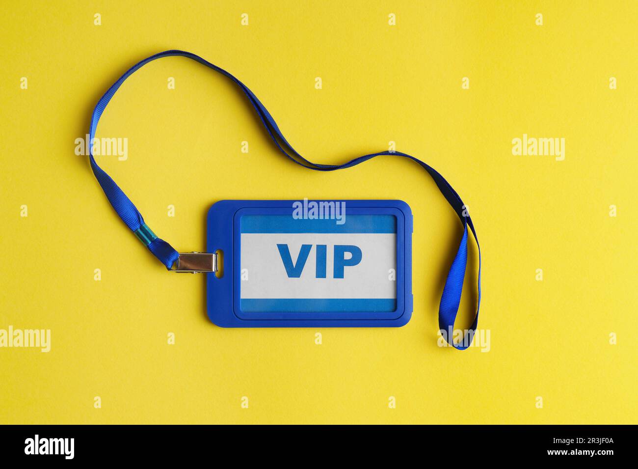 Vip badge on yellow background, top view Stock Photo - Alamy
