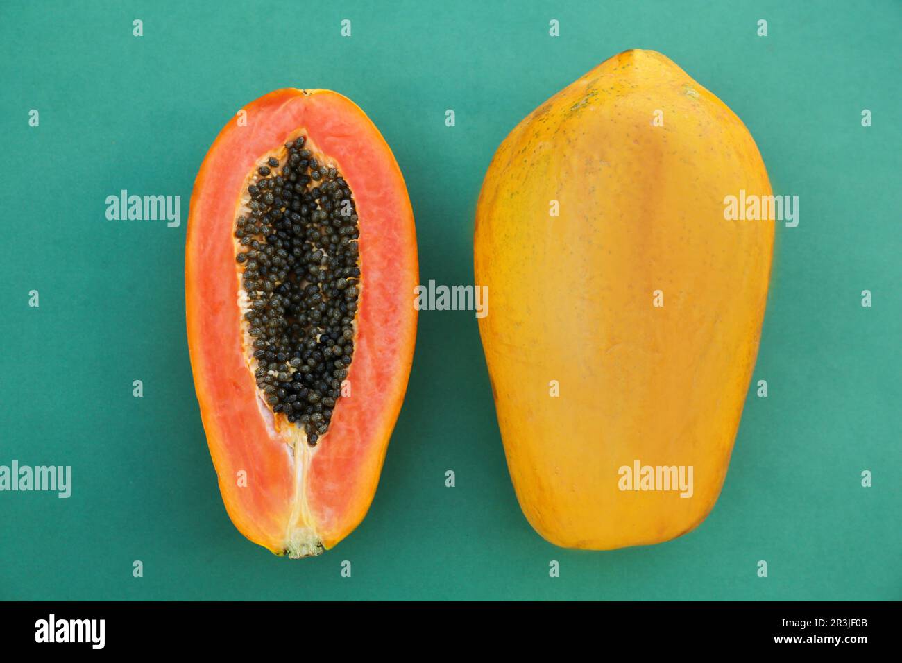 Fresh ripe cut and whole papaya fruits on light blue background, flat ...