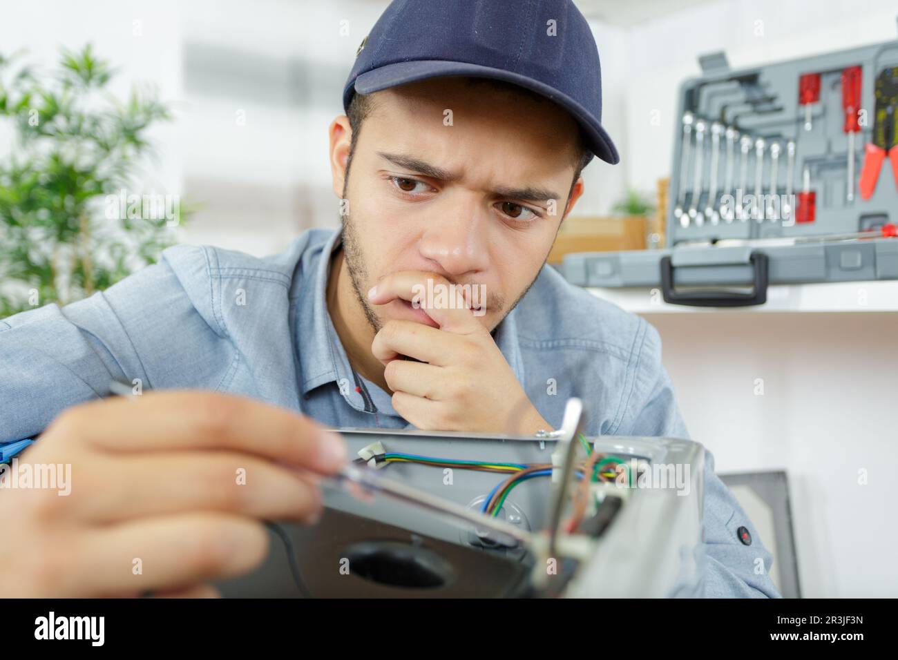 an engineer thinking about instalation Stock Photo - Alamy