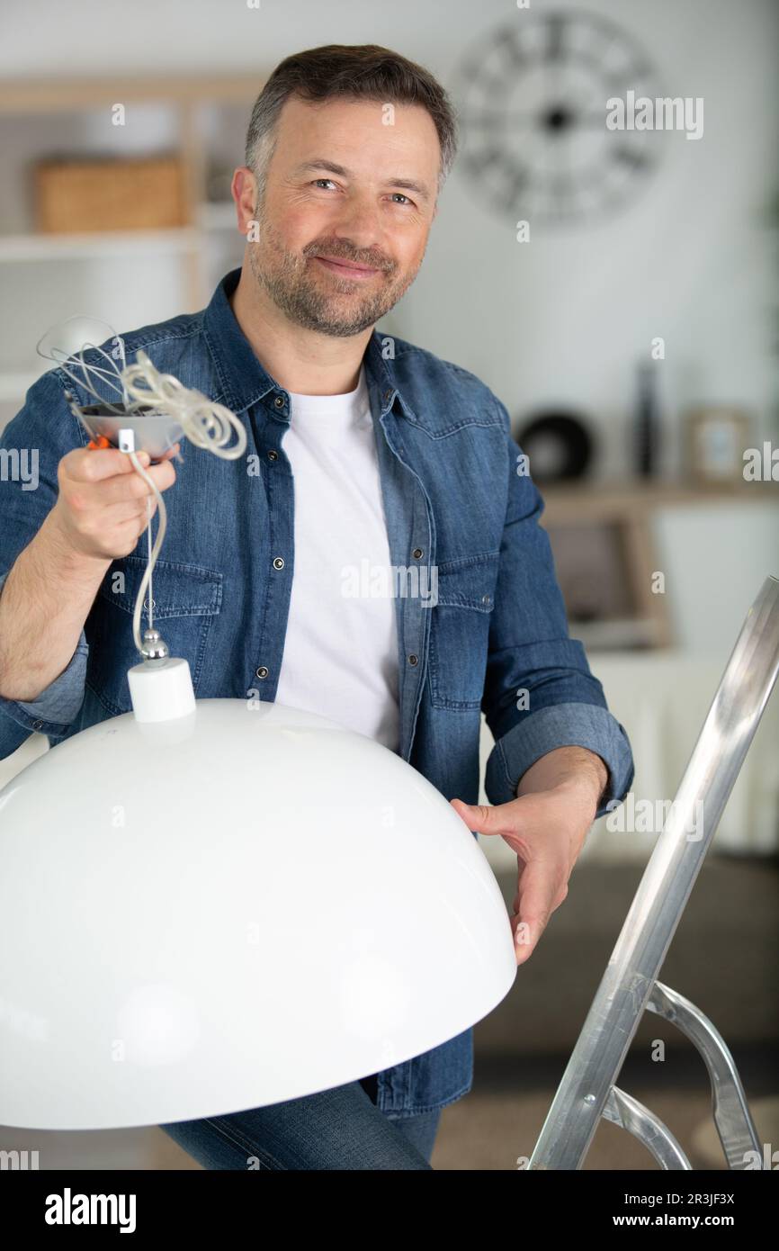Construction worker installing loft hi-res stock photography and images ...