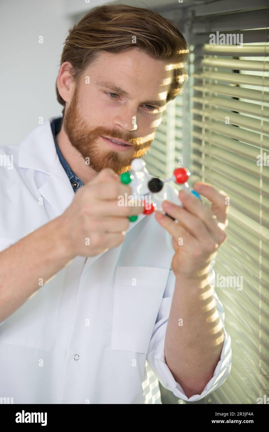 man scientist working with model of molecule Stock Photo - Alamy
