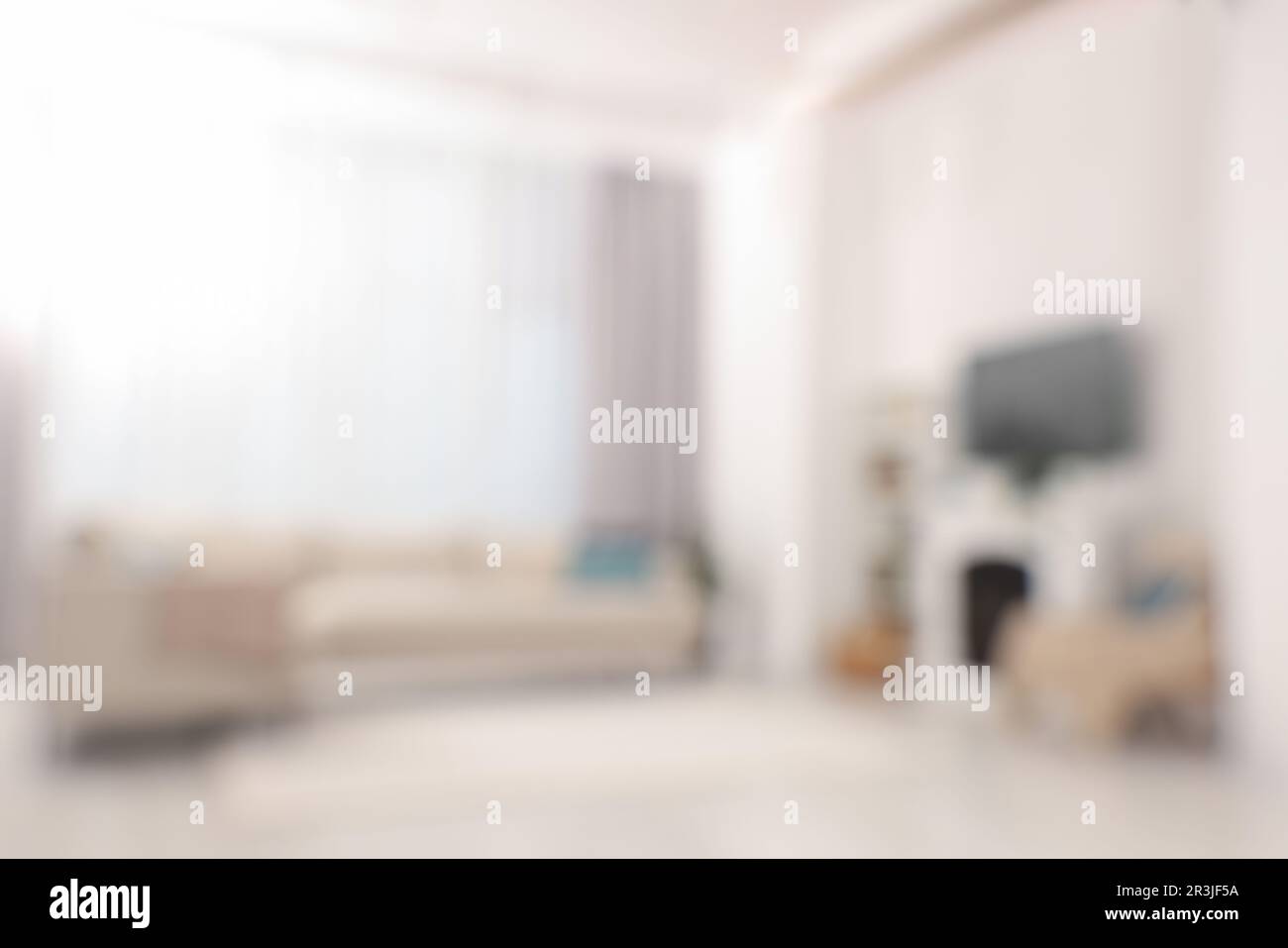 Blurred view of stylish living room interior with cozy sofa Stock Photo ...