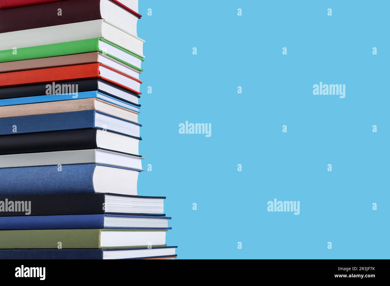 Stack of hardcover books on light blue background. Space for text Stock ...