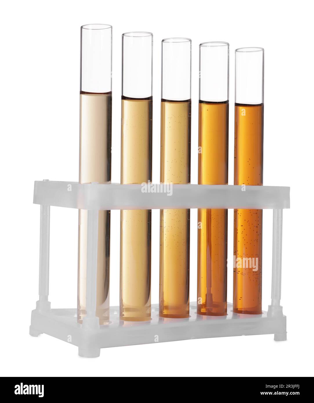 Test tubes with brown liquid in stand on white background Stock Photo ...