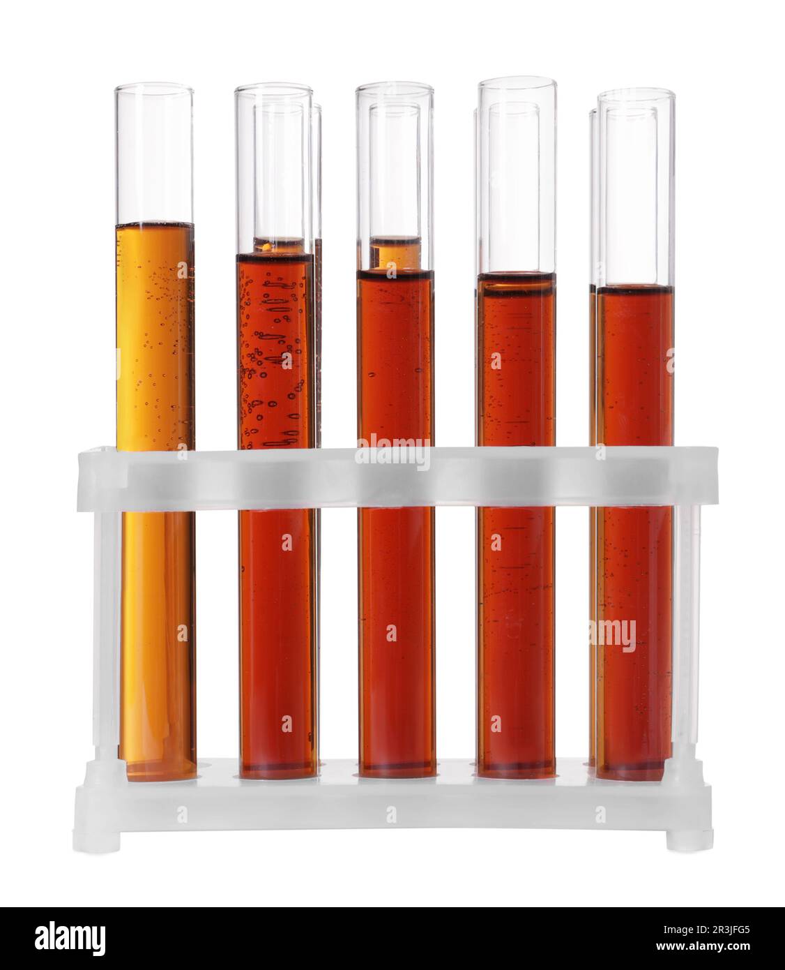 Test tubes with brown liquid in stand on white background Stock Photo ...