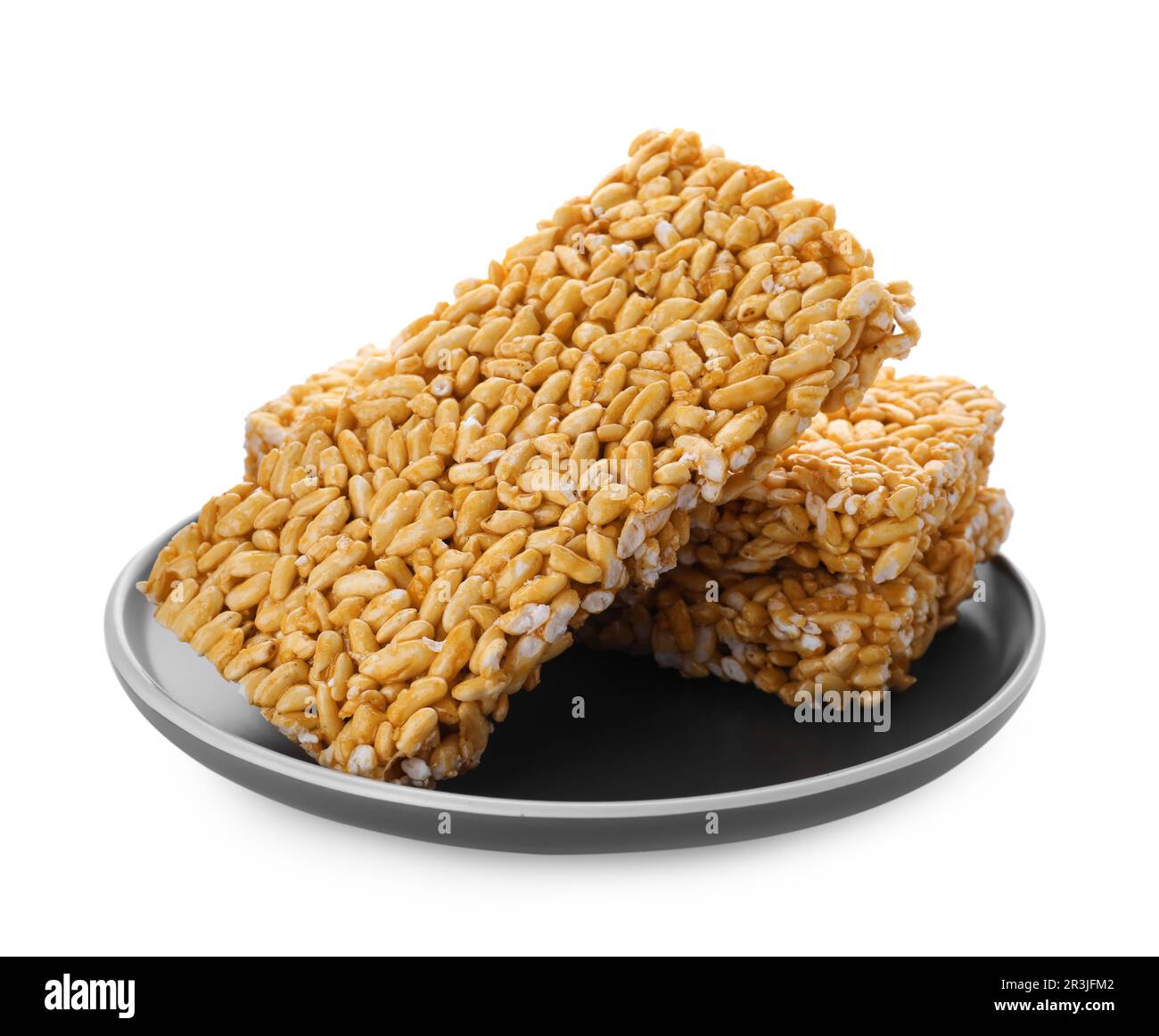 Plate with puffed rice bars (kozinaki) on white background Stock Photo ...