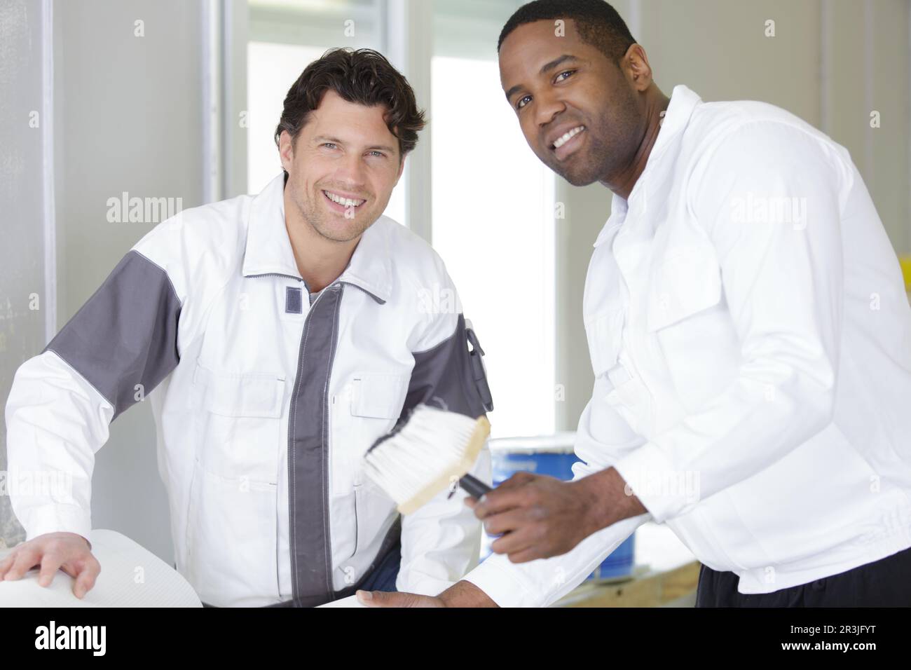 workmen at work in construction site Stock Photo - Alamy