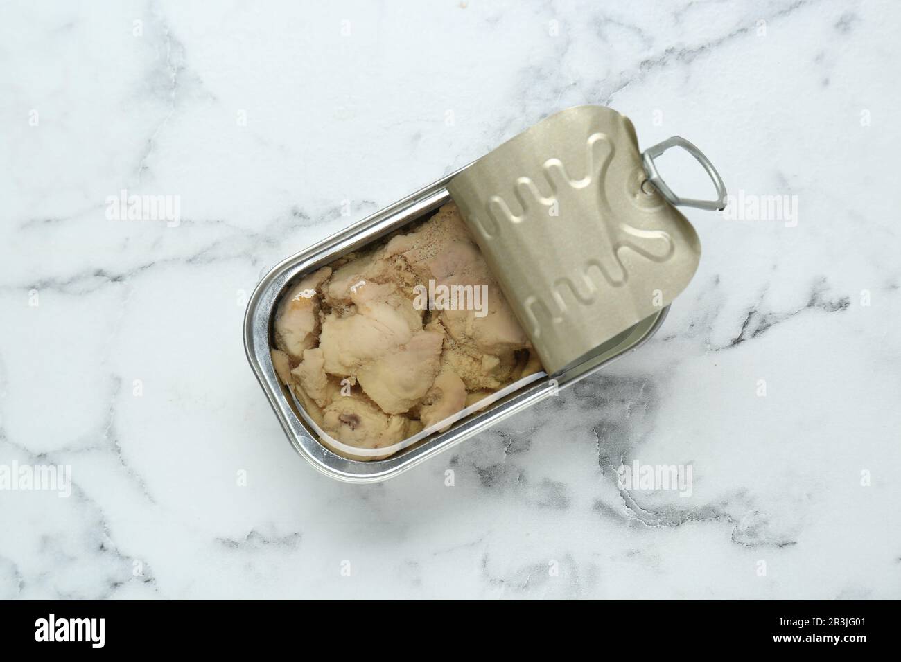 Open tin can of tasty cod liver on white marble table, top view Stock ...