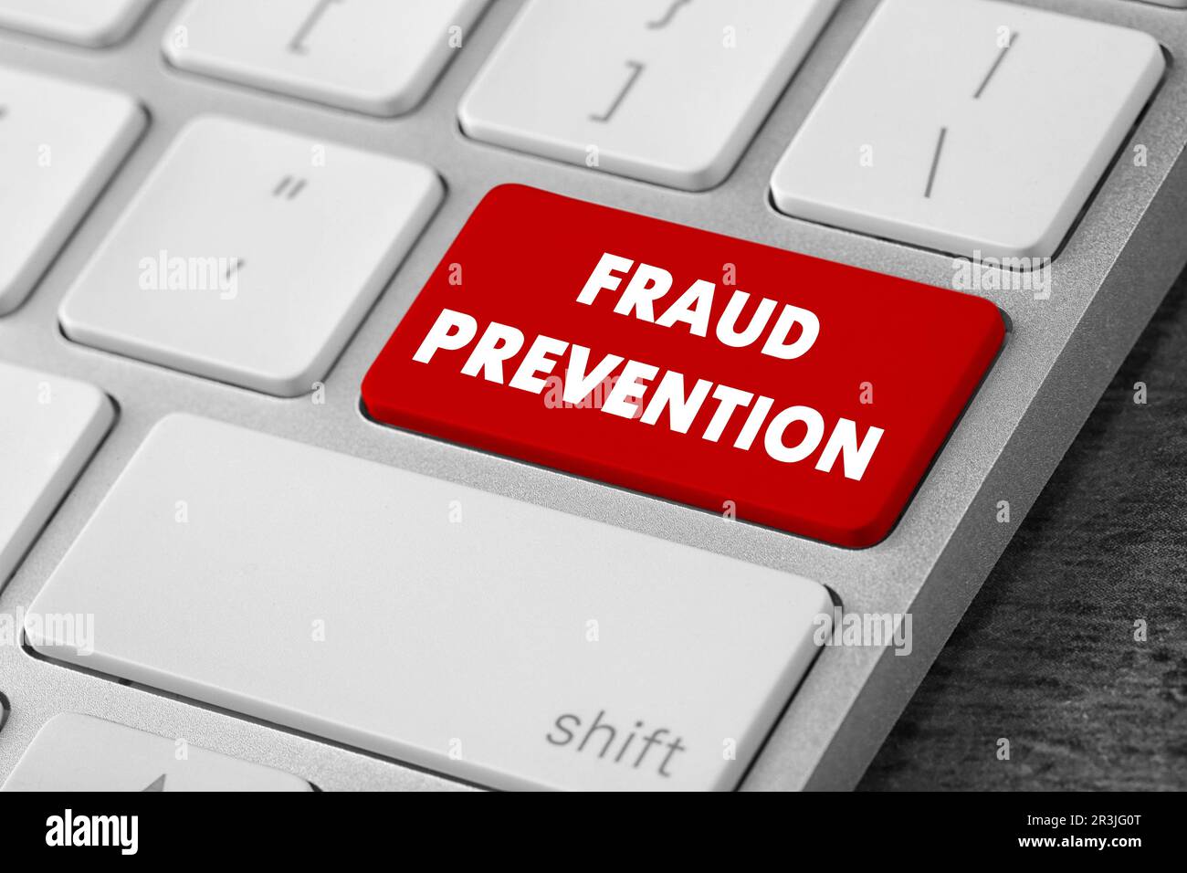 Red button with phrase Fraud Prevention on computer keyboard, closeup ...