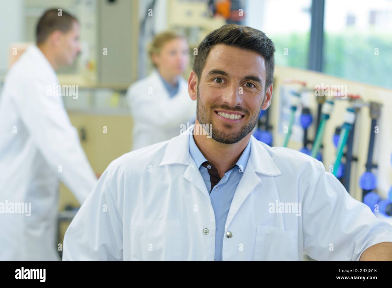 a cheerful male scientist smiling Stock Photo - Alamy